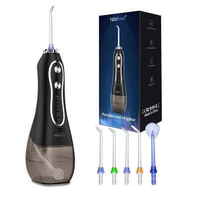 China Waterproof Level IPX7 Cordless Oral Irrigator with 300ml Water Tank and 5 Powerful Cleaning Modes for sale