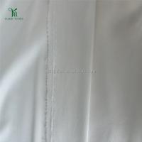 China High Quality 115-120gsm White Knitted Fabric Elastic Polyester Greige Fabric Popular Export for Vest Camisole Woven Plain for sale
