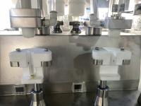 China Desktop Aseptic Syringe Filling Machine with Laminar Flow Frame for sale