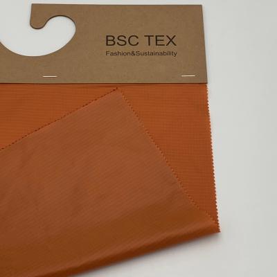 China Polyester Nylon Ribstop Light weight Puffer Jacket Fabric for sale