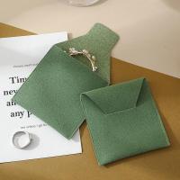 China Luxury bag Customized LOGO Green Flannel Anti-Oxidation Jewelry Bag Thickened Microfiber Jewelry Bag Ring Storage Bag for sale