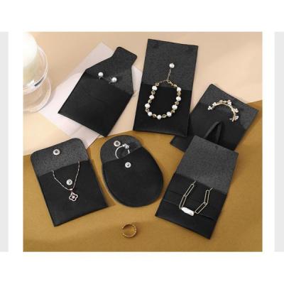 China Environmentally Friendly Customized LOGO Black Velvet Bag Jewelry Snap Button Bag Thickened Velvet Ring Jewelry Storage Bag for sale