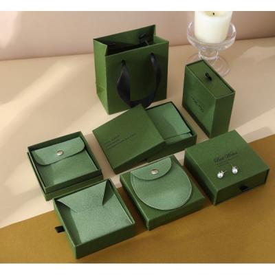 China Batch Customized LOGO Kapok Green Jewelry Storage Drawer Box Velvet Bag Set Light Luxury World Cover Jewelry Packaging Box for sale