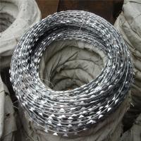 China Hot Dip Galvanized Razor Barbed Wire BTO-22 - 450m × 25kg Coils with 0.4mm Thickness and 2.5mm Wire Diameter for sale
