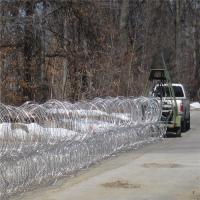 China Galvanized Concertina Razor Wire BTO-22 450mm Coil Diameter Anti-Climb Security Fence for sale