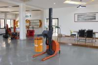 China Rated Load 500kg Nylon Wheel Semi Electric Pneumatic Roll Turner Stacker With Electric Lifting And Rotation for sale