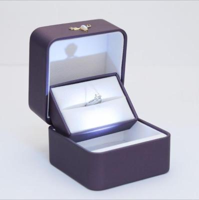 China Luxury LED Jewelry Box with Automatic Lighting Elegant Luster and Durable PU Leather Ring Box for sale