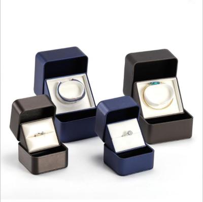 China Custom Square PU Leather Jewelry Box with Embossing Gold Label Luxury Packaging 10x10cm for sale