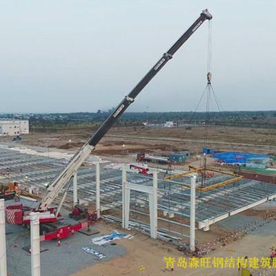 China Lightweight Steel Frame Buildings Sturdy Metal Building Warehouse With Round Bracing Bars for sale