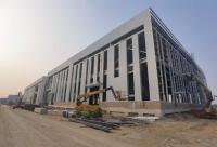 China Industrial Steel Frame Warehouse With H Beam And Sandwich Panel Roof Cladding for sale