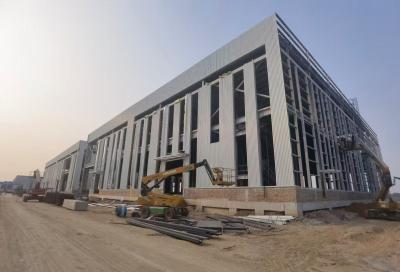 China Industrial Steel Frame Warehouse With H Beam And Sandwich Panel Roof Cladding for sale