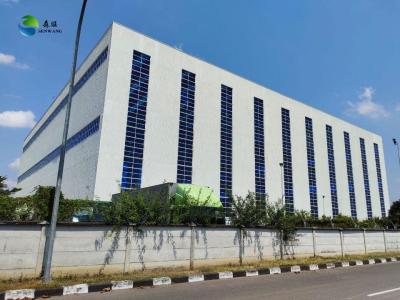 China Corrosion Resistant Painted Steel Structure Warehouse with Roll-up Door Type and Custom Dimensions for sale