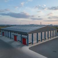 China Wind Load 0.35 kN/m² and Earthquake Resistance Grade 8 Steel Structure Warehouse with Galvanized Surface Treatment for sale