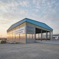 China Customized Q355B Raw Steel Material Prefabricated Steel Warehouse with Sandwich Panel Thickness 50-200mm and Earthquake Resistance Grade 8 for sale