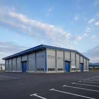 China Silver Surface Color Steel Frame Warehouse Equipped With Main Structure H Section Column Beam Ensuring Robustness And Space Utilization for sale