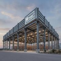 China 50 Years Structural Metal Structure Warehouse Featuring Strong H Section Steel Construction Ideal for Commercial Storage for sale