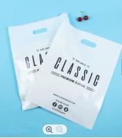 China Recyclable Die Cut Shopping Bag Waterproof Poly Soft Loop Handle Bags for sale