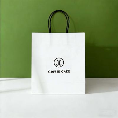 China Custom Disposable Kraft Paper  Twisted  Handle  Bag Printing Shopping Bags for sale