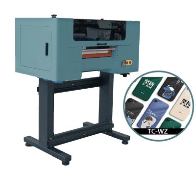 China CMYKW Varnish Plastic Digital Shirt Printing Machine - 300mm Width Flatbed Inkjet Printer with 3m²/h Speed and 20ml Ink Consumption for sale