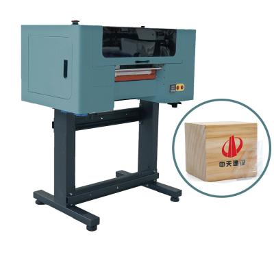 China AB Film DTF UV Printer with 300mm Width and CMYK+W+V Color System for Industrial Printing for sale