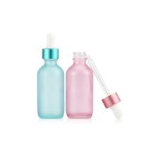 China Semi Transparent Blue Pink Glass Dropper Empty Essential Oil Bottle 30ml for sale