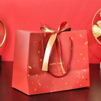 China Offset Printing Custom Paper Gift Bags Gift Shopping Bag With Handle And Ribbon for sale