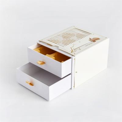 China Customized creative hollowed out cosmetic box packaging paper box Customized double layer drawer box for sale