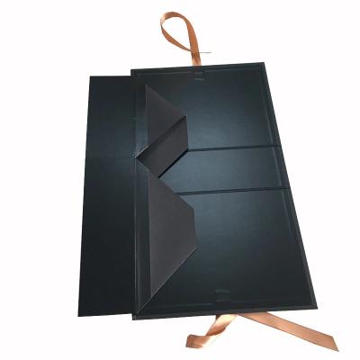 China Cardboard Folding Magnetic Cosmetic Packaging Boxes With Ribbon for sale