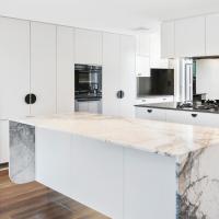 China PVC Kitchen Cabinet with Semicircular Handle 18mm Plywood Carcass 20mm Granite Countertop for sale