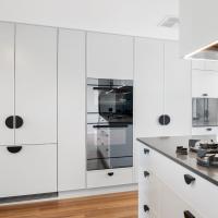 China PVC Kitchen Cabinet with Semicircular Handle 18mm Plywood Carcass 20mm Granite Countertop for sale