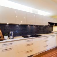 China Custom Made PVC Kitchen Cabinet White Plain And Black Wood Grain for sale