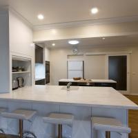 China Custom L Shape PVC Kitchen Cabinet Island White Wood Grain Modular 18mm MDF for sale