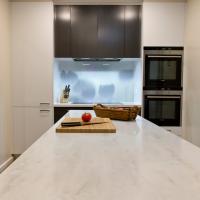 China Custom L Shape PVC Kitchen Cabinet Island White Wood Grain Modular 18mm MDF for sale