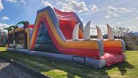 China Unisex Commercial Inflatable Jurassic Dinosaur Obstacle Course for Kids and Adults for sale