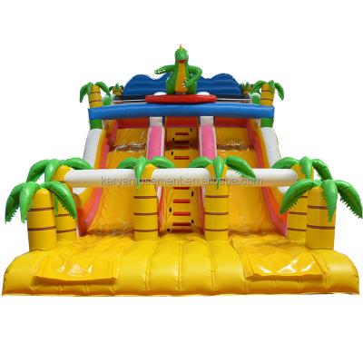 China Outdoor Park Game 2-Lane Tropical Palm Tree PVC Inflatable Dinosaur Jump Bounce Slide for sale