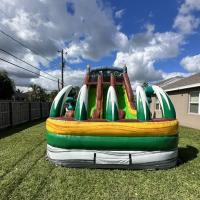 China Max Capacity 100-500kg Large Jumping Jungle Dino Water Slide for Commercial Rental for sale
