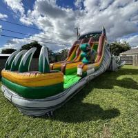 China Max Capacity 100-500kg Large Jumping Jungle Dino Water Slide for Commercial Rental for sale