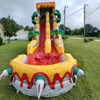 China Large Adult Inflatable Slides 36ft Thrilling Jumping Game with Tropical Dinosaur Theme for sale