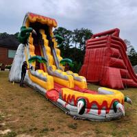 China Large Adult Inflatable Slides 36ft Thrilling Jumping Game with Tropical Dinosaur Theme for sale