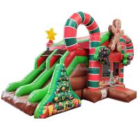 China Indoor/Outdoor Commercial Inflatable Christmas Bounce House with Double Slides and Blower for sale