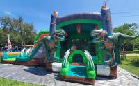 China Jurassic Dinosaurs Commercial PVC Inflatable Bounce House with Slide With Blower for sale