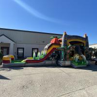 China Jurassic Dinosaurs Commercial PVC Inflatable Bounce House with Slide With Blower for sale