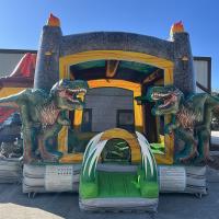 China Jurassic Dinosaurs Commercial PVC Inflatable Bounce House with Slide With Blower for sale