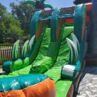 China Jurassic Dinosaurs Commercial PVC Inflatable Bounce House with Slide With Blower for sale