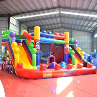 China PVC 23ft Crossover Building Block Castle Inflatable Bounce House with Slide and Blower for sale