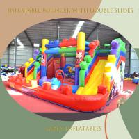 China PVC 23ft Crossover Building Block Castle Inflatable Bounce House with Slide and Blower for sale
