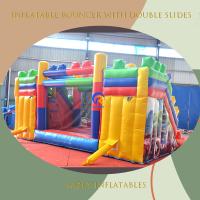 China PVC 23ft Crossover Building Block Castle Inflatable Bounce House with Slide and Blower for sale