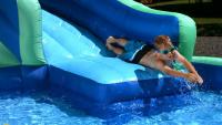 China Outdoor Commercial Inflatable Water Slide with USA Flag Style and Super Long Slip Lane for sale
