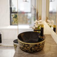China Luxury Oval Freestanding Vanity Basin Black Gold Ceramic 560x410mm with Faucet for sale