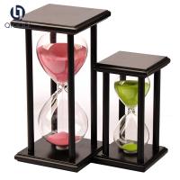 China Beautiful home and office decoration colorful hourglass with wooden frame for sale
